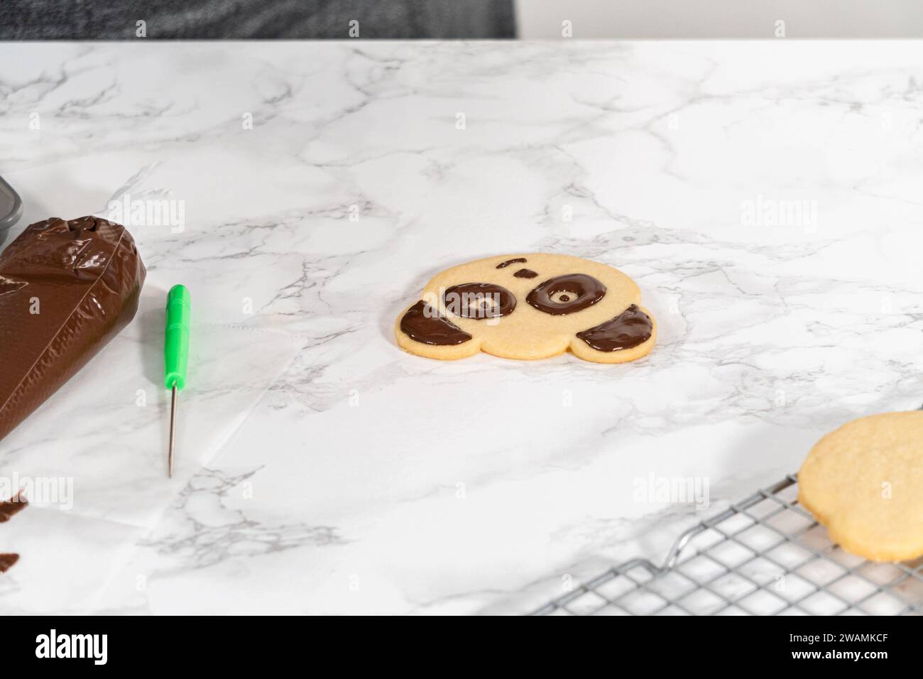 Panda shaped shortbread cookies with chocolate icing Stock Photo - Alamy