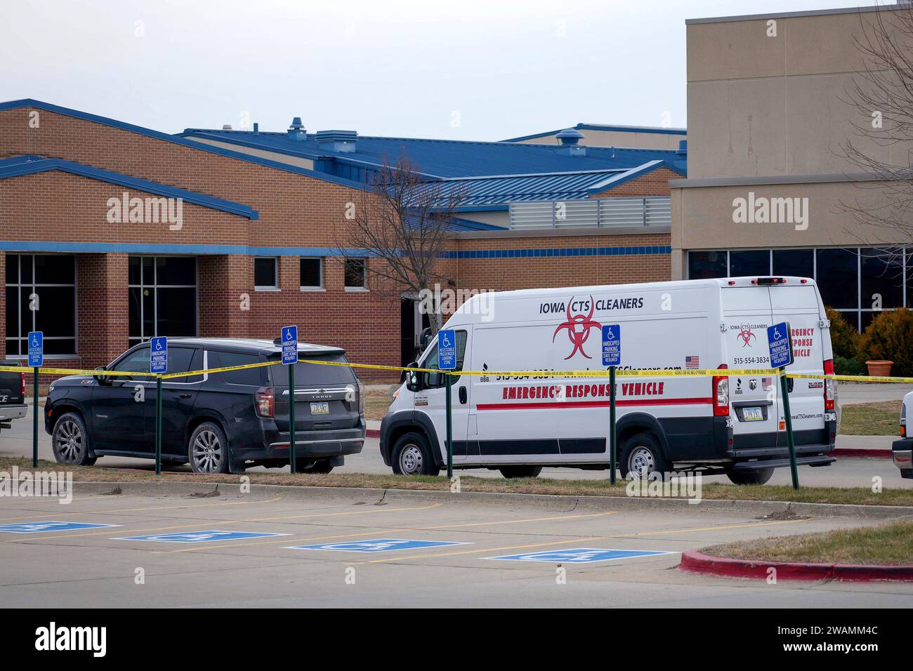 Emergency vehicles remain parked at the Perry Middle School and High ...