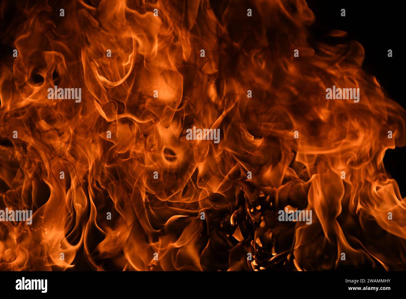 Blaze burning fire flame on art texture background Stock Photo - Alamy