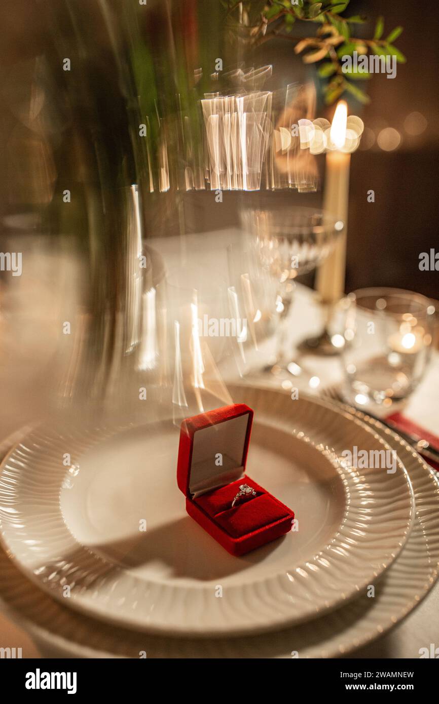 engagement ring in red box on served table Stock Photo - Alamy