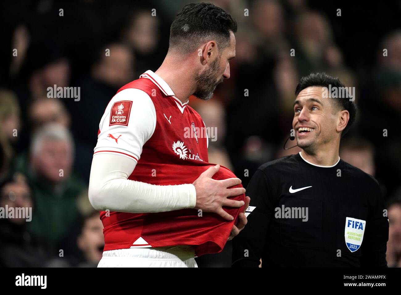Rotherham United's Sean Morrison (left) speaks with assistant referee ...