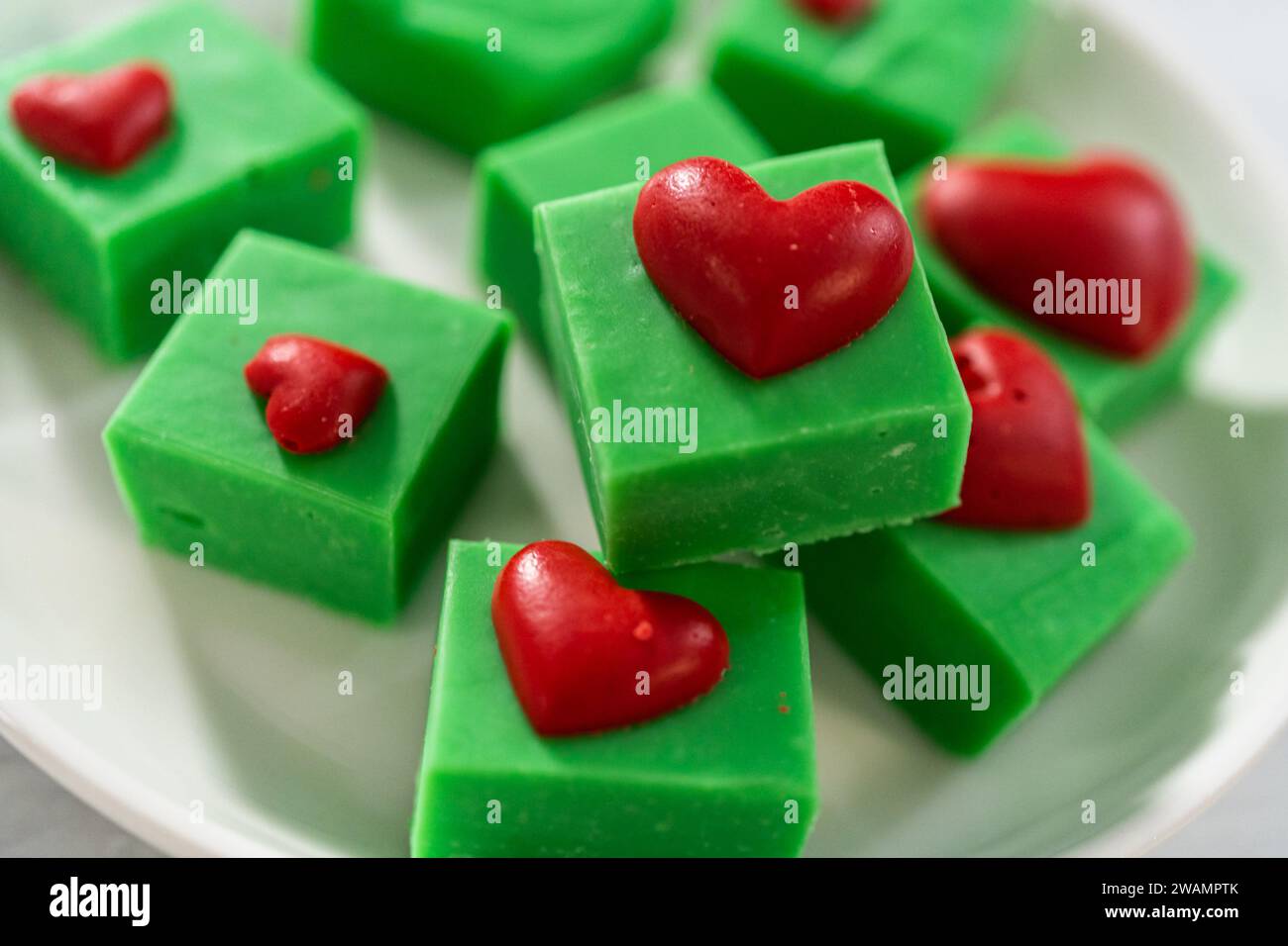 Green fudge with red hearts Stock Photo - Alamy