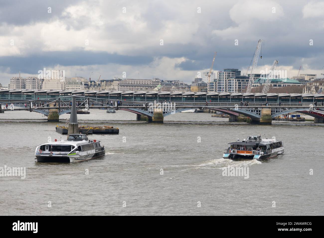 London, UK - March 18, 2023; Thames Clipper fast ferry boats on the ...