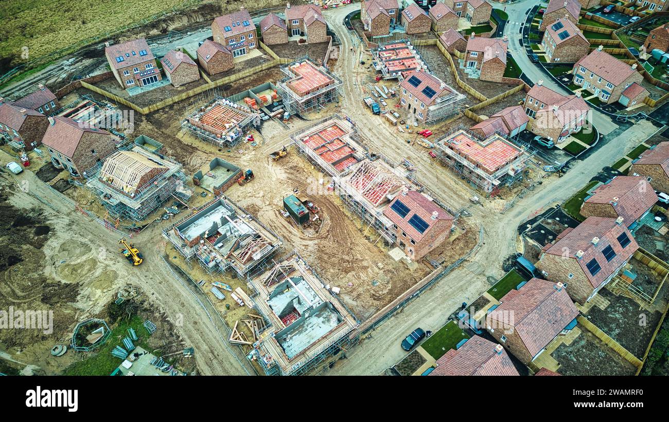 Aerial view of a residential construction site with partially completed ...