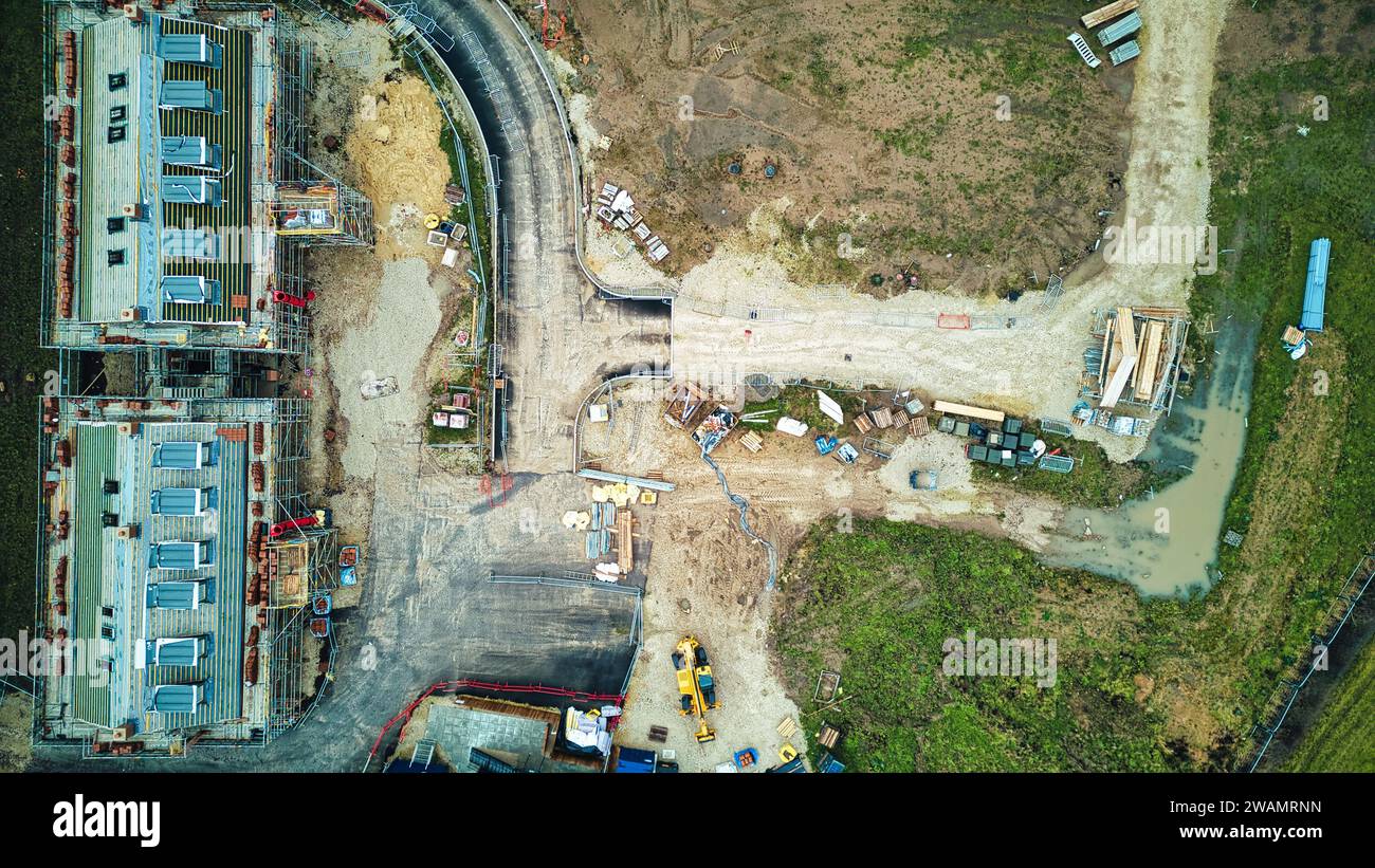 Aerial view of a construction site with building foundations and ...