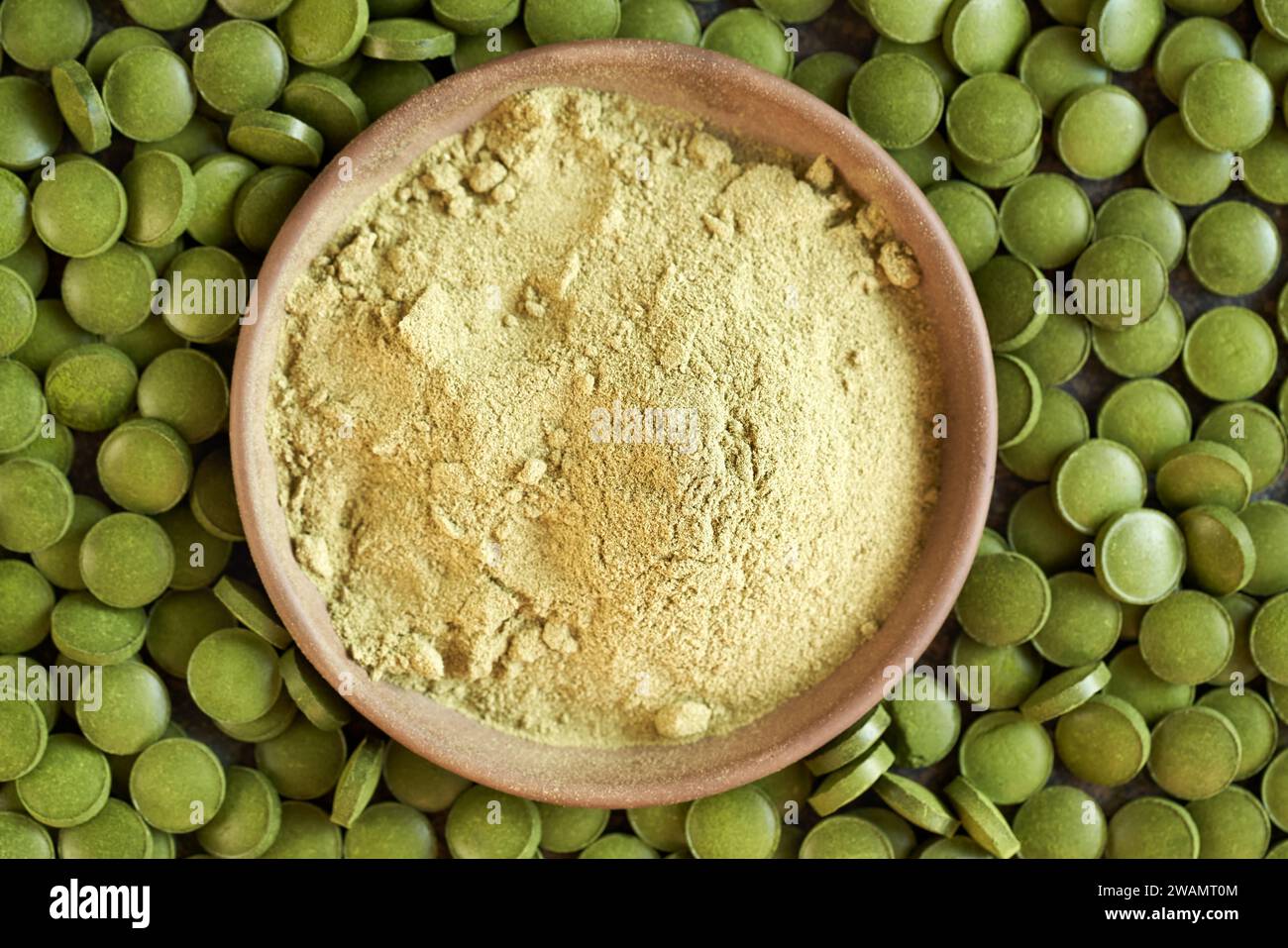 Green barley grass powder and tablets, top view Stock Photo - Alamy