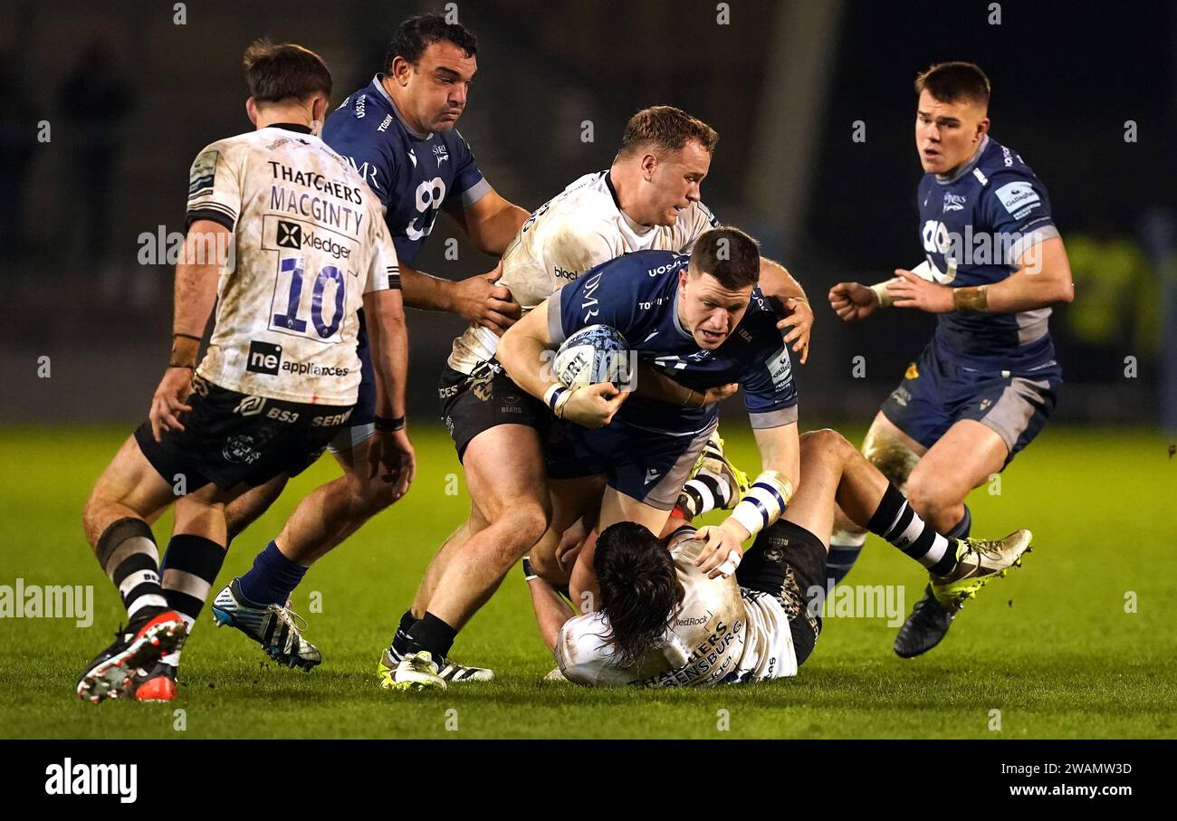 Sale Sharks' Sam James is tackled by Bristol Bears' James Williams and ...