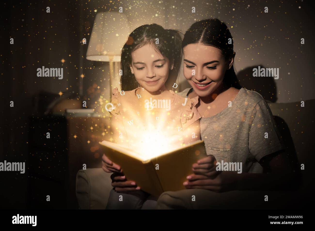 Shiny magic book with letters flying over it. Girl with her mother ...