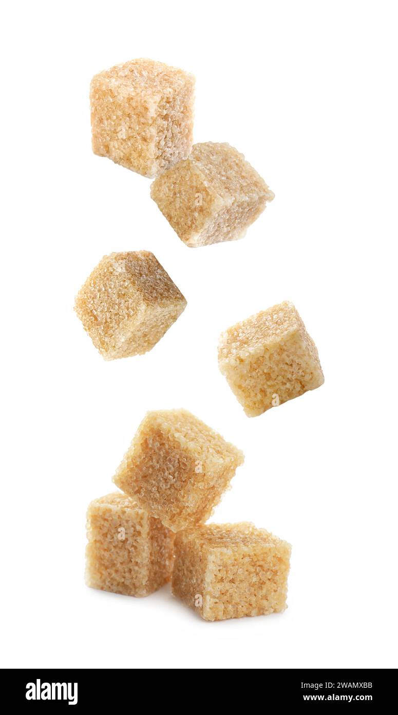 Cubes of brown sugar falling on white background Stock Photo - Alamy