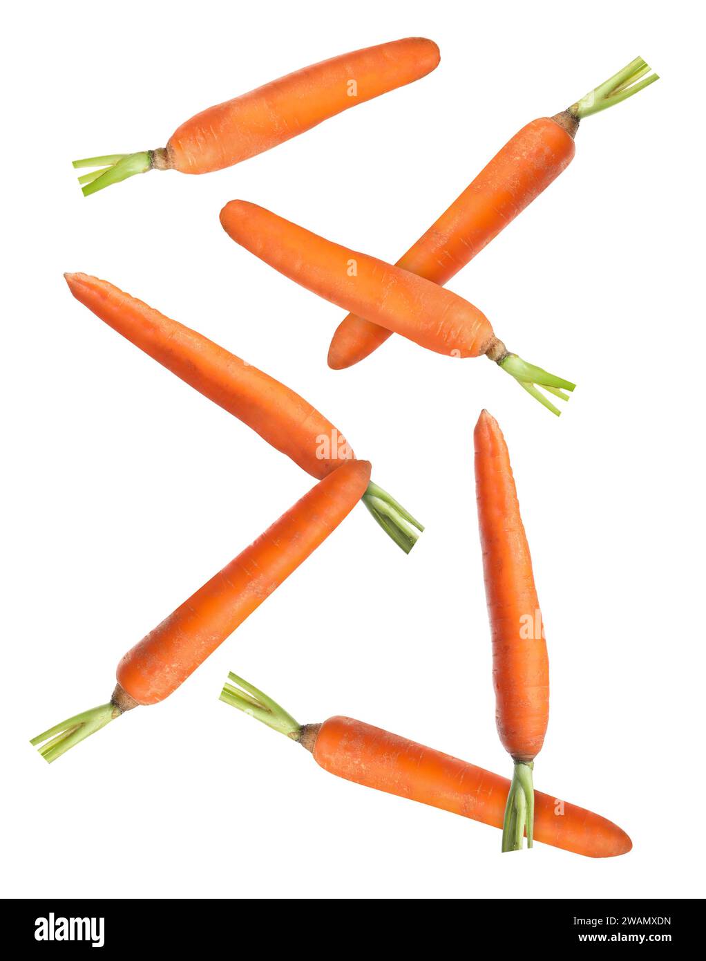 Fresh ripe carrots falling on white background Stock Photo - Alamy