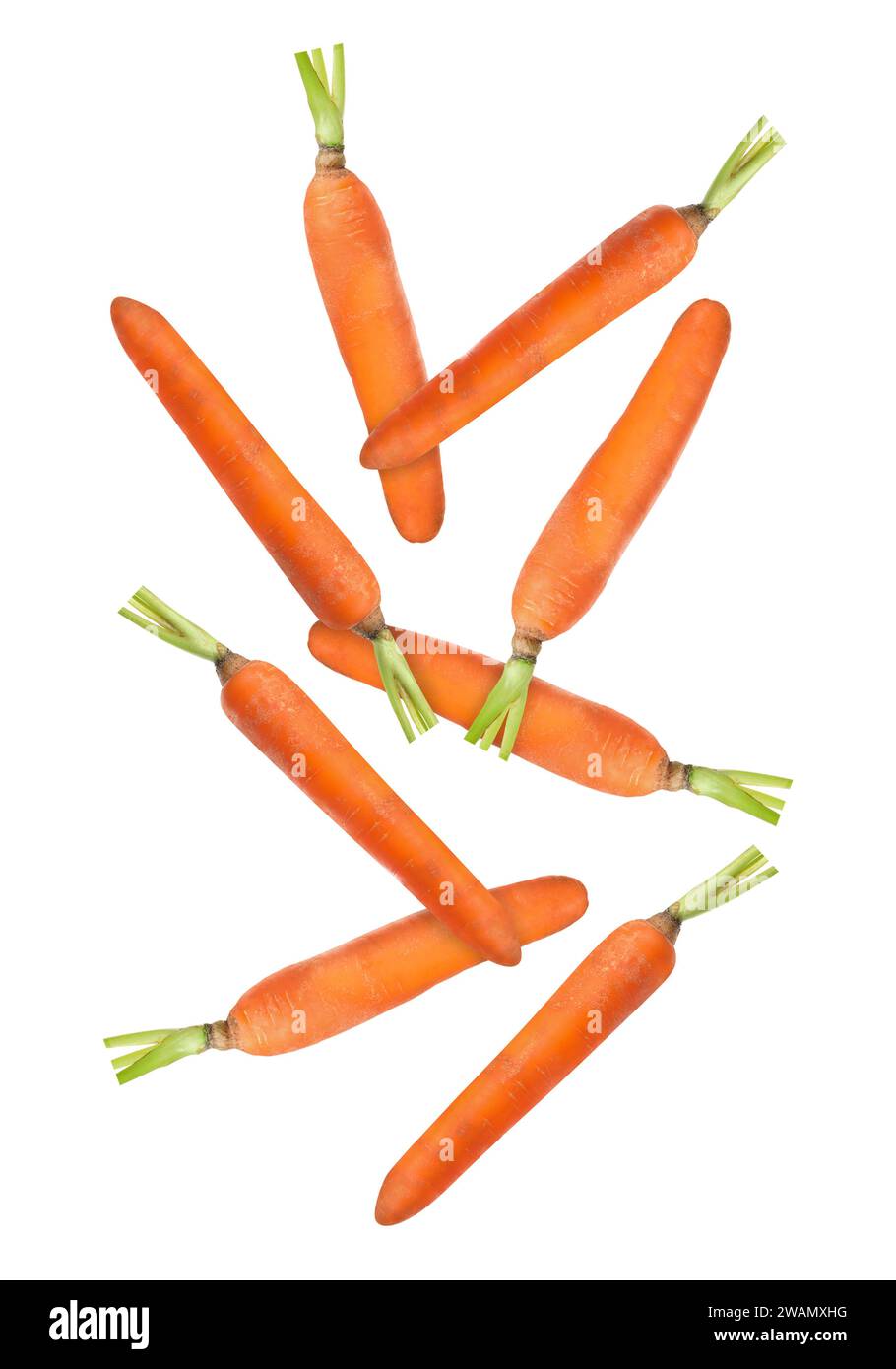 Fresh ripe carrots falling on white background Stock Photo - Alamy