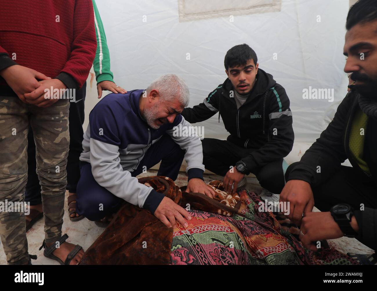 Palestinians who lost their loved ones mourn as bodies of the deceased ...