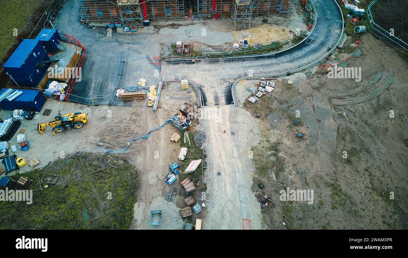 Aerial view of a construction site with heavy machinery and building ...