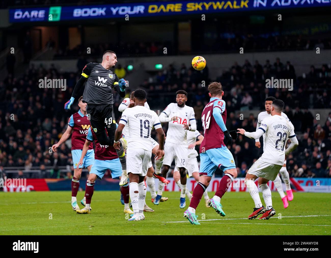 Burnley goalkeeper Arijanet Muric attempts to head the ball towards ...