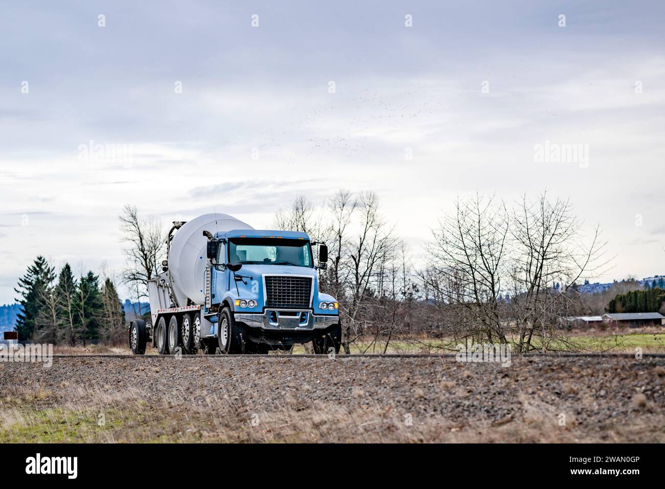 Industrial carrier blue day cab big rig semi truck with concrete mixer ...