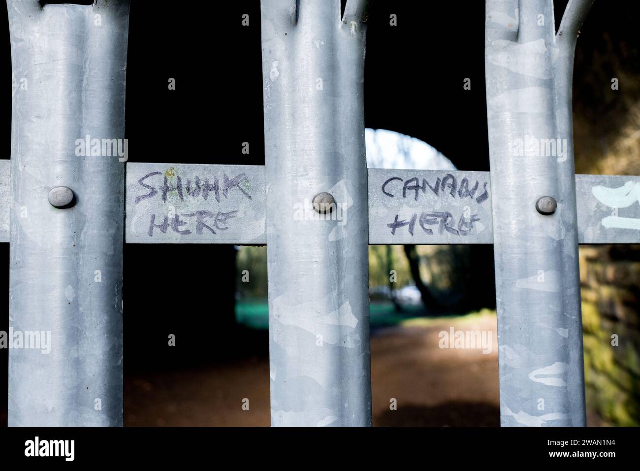 Galvanized metal fencing or railings with the drug name Skunk or ...