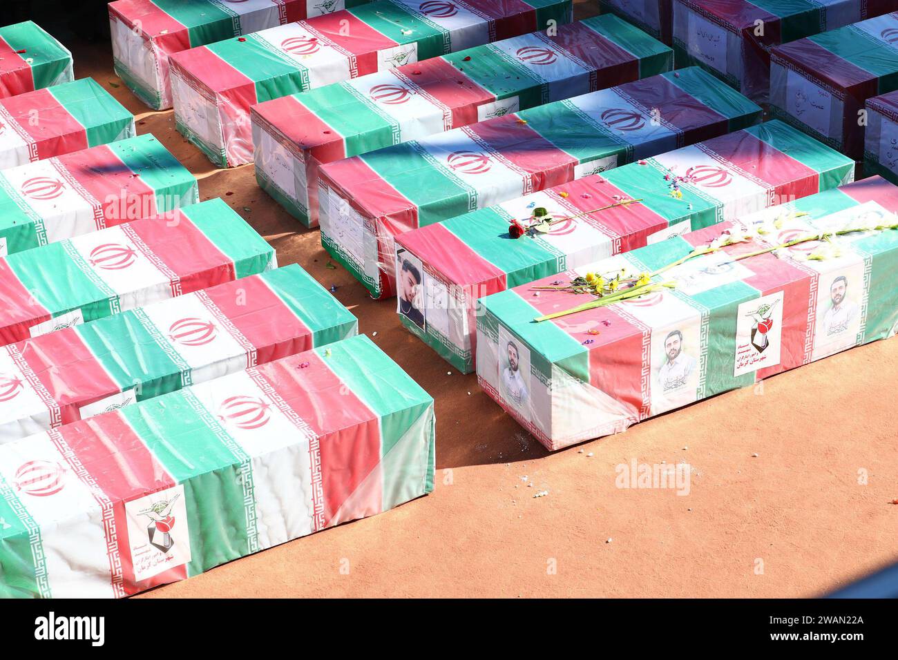 Kerman, Iran. 5th Jan, 2024. The flag-draped coffins are placed on the ...