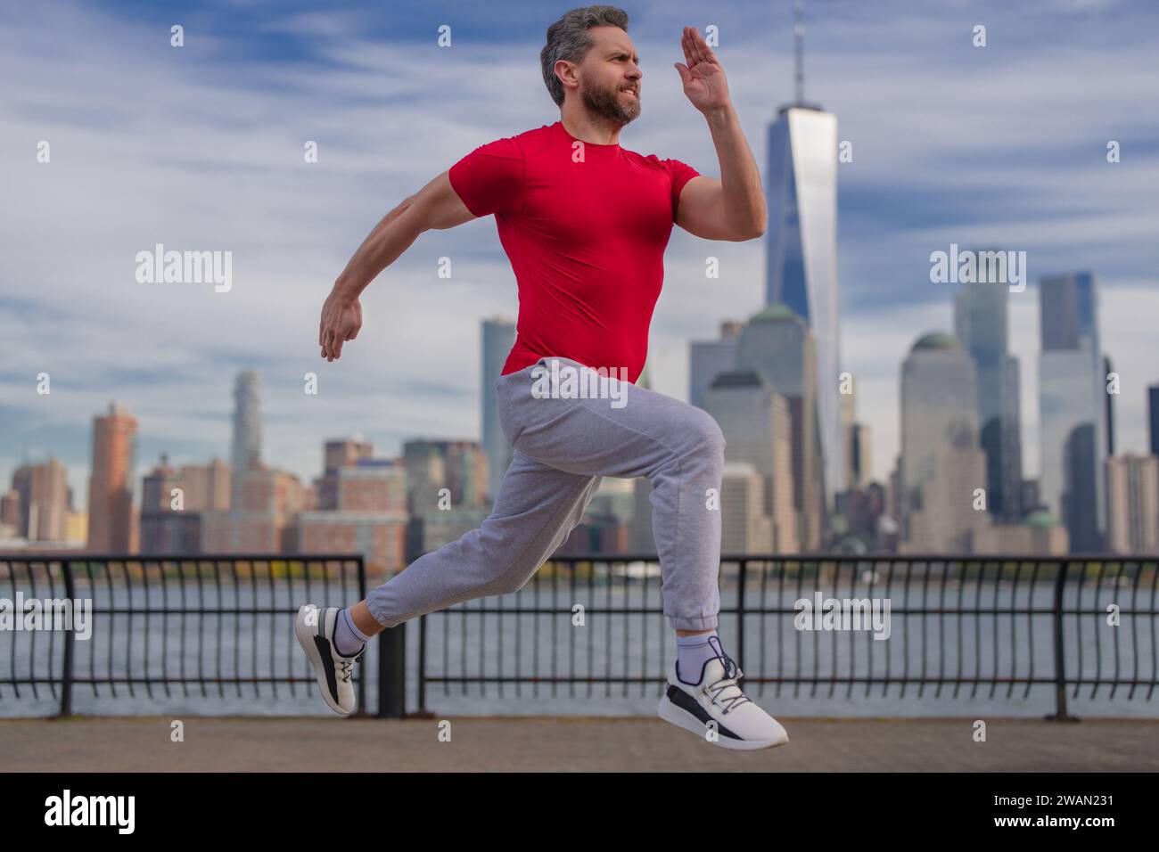 Sportsman running in middle street hi-res stock photography and images ...