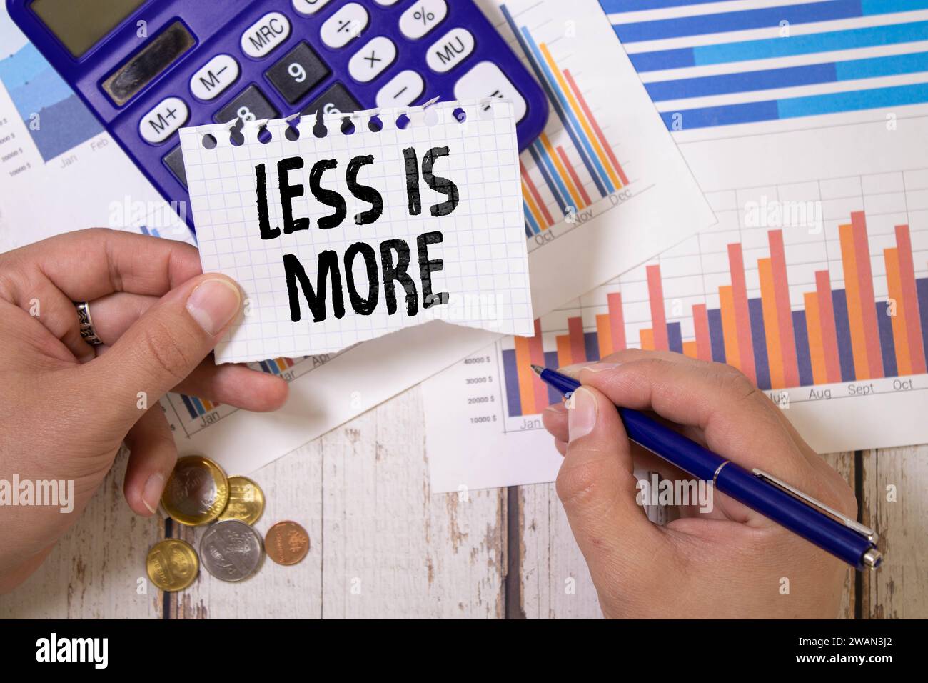 Less is more word concept on cubes Stock Photo - Alamy