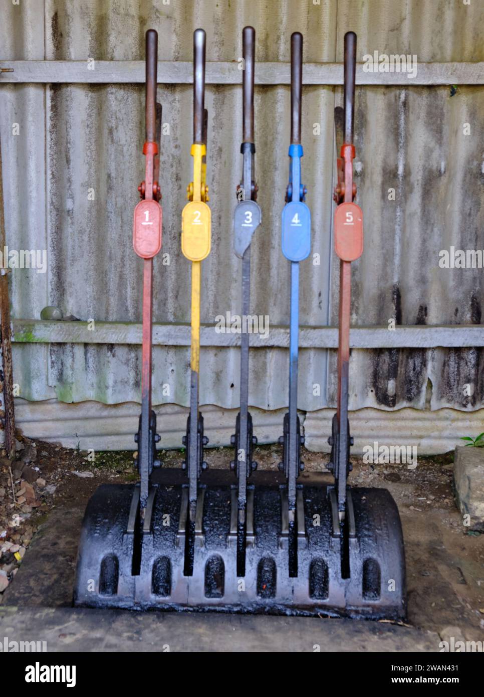 multiple coloured vintage train track change levers, numbered one to ...