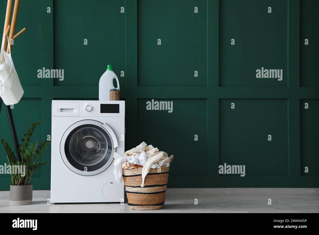 Interior of laundry room with washing machine, basket and rack Stock ...