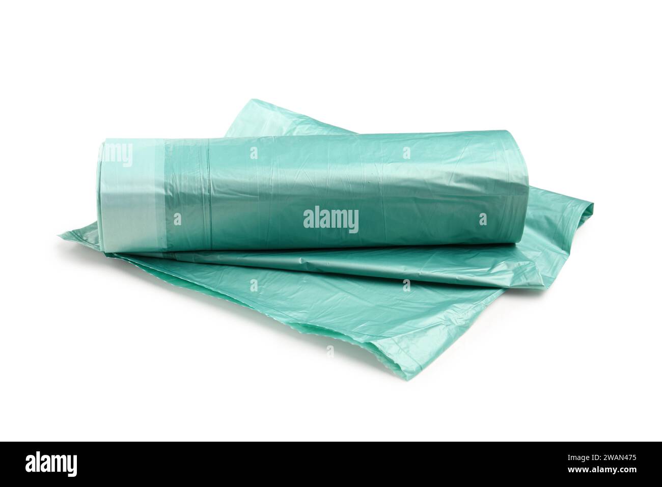 Green roll of garbage bags isolated on white background Stock Photo - Alamy