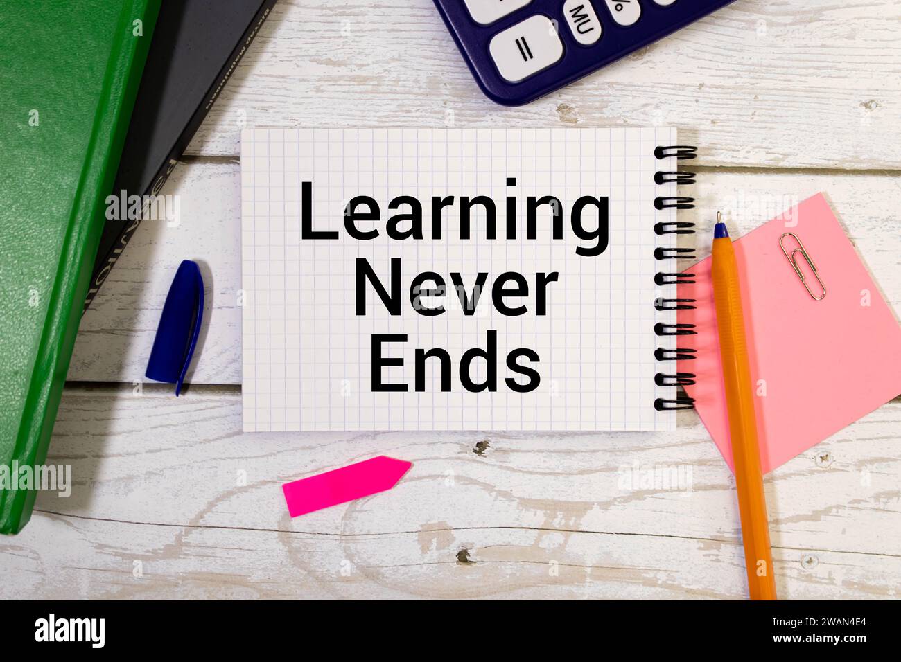 Word text Learning never end on white paper on office table / business ...