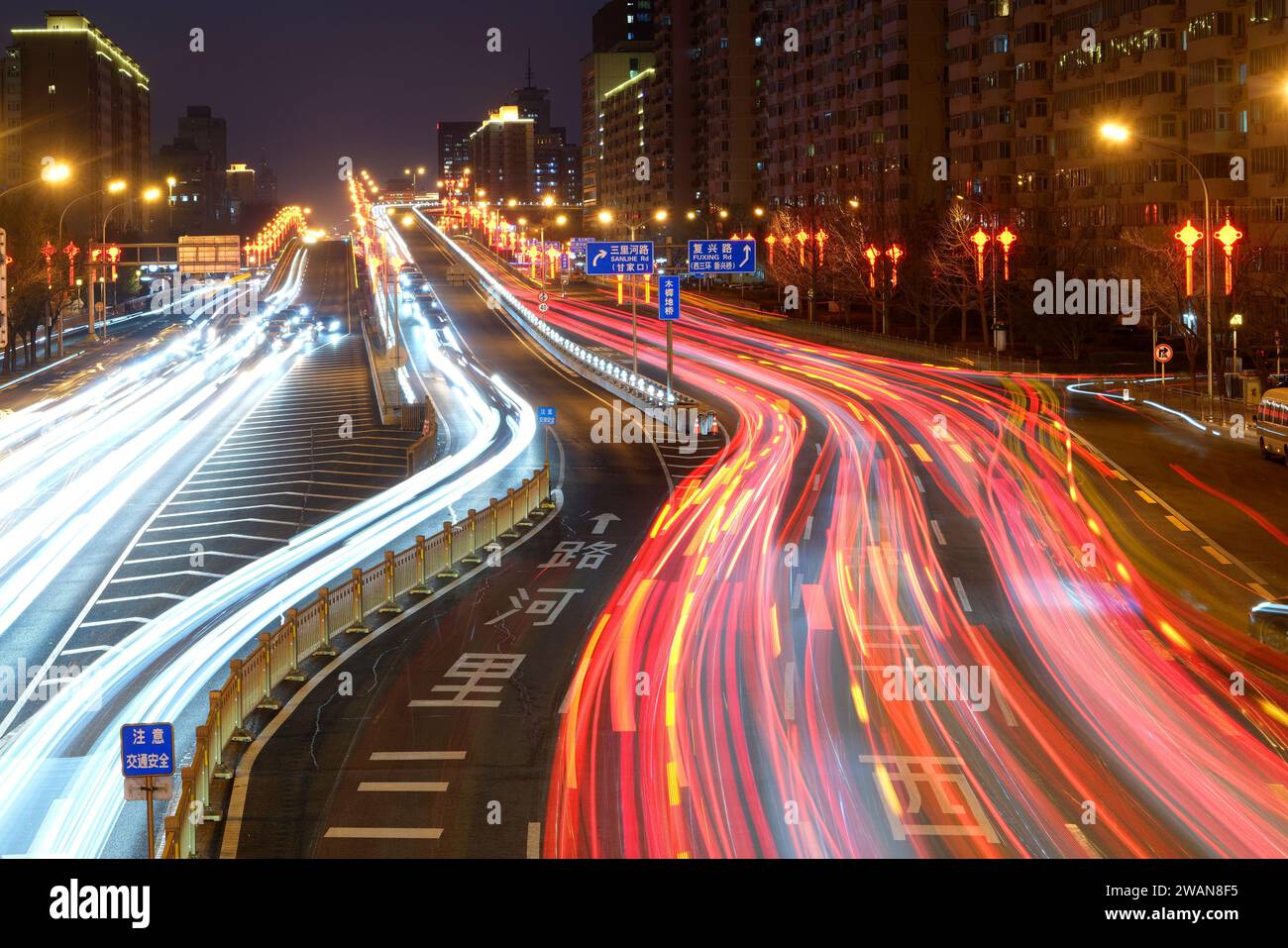 BEIJING, CHINA - JANUARY 5, 2024 - The brightly lit Muxidi overpass on ...