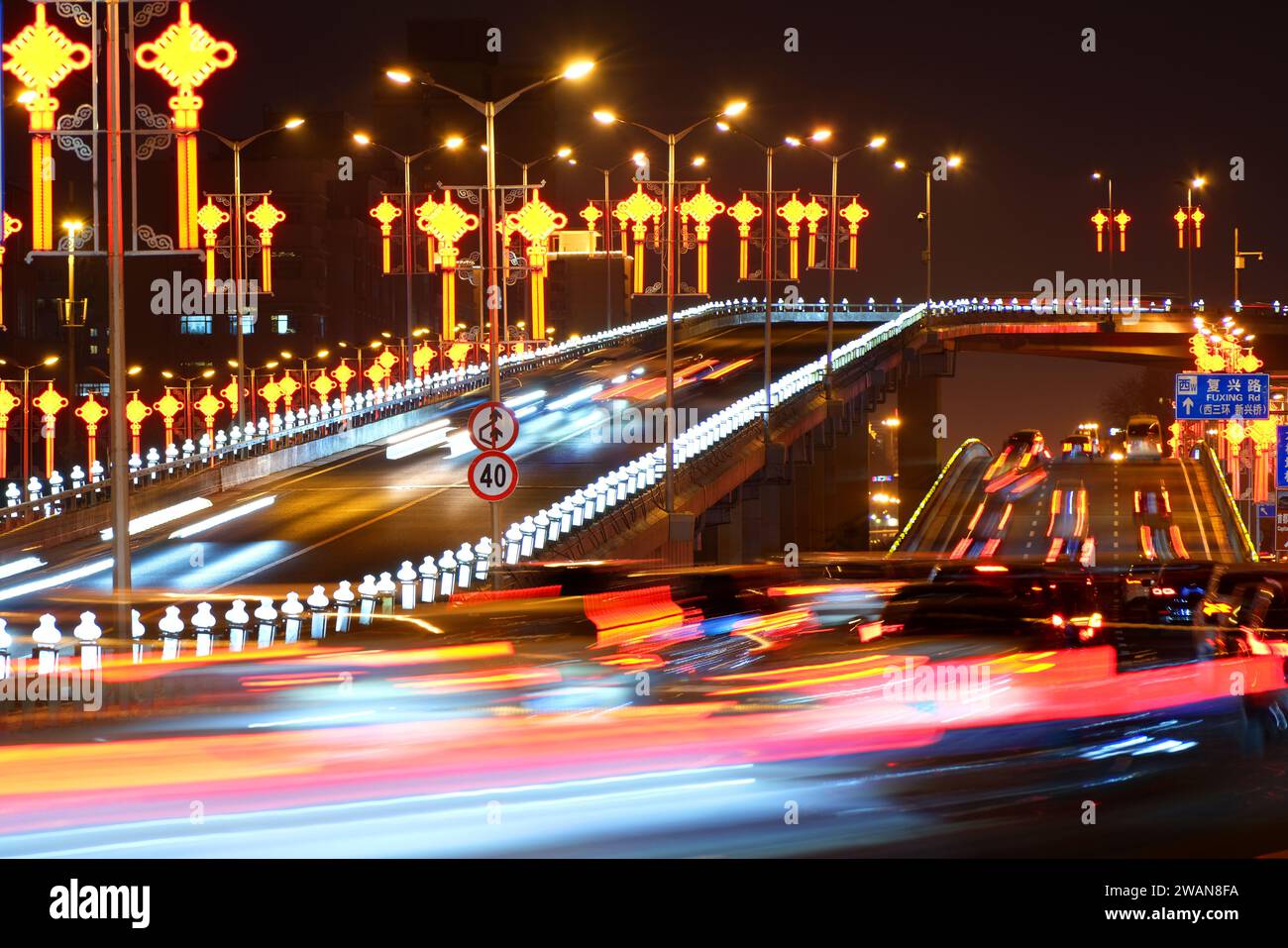 BEIJING, CHINA - JANUARY 5, 2024 - The brightly lit Muxidi overpass on ...