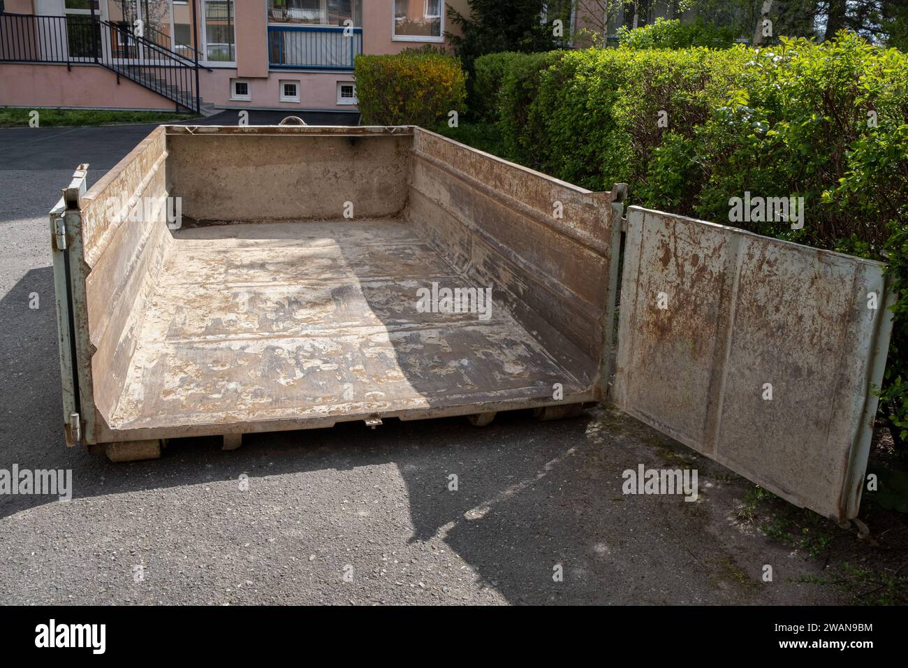 An empty construction waste container ready for materials from a ...