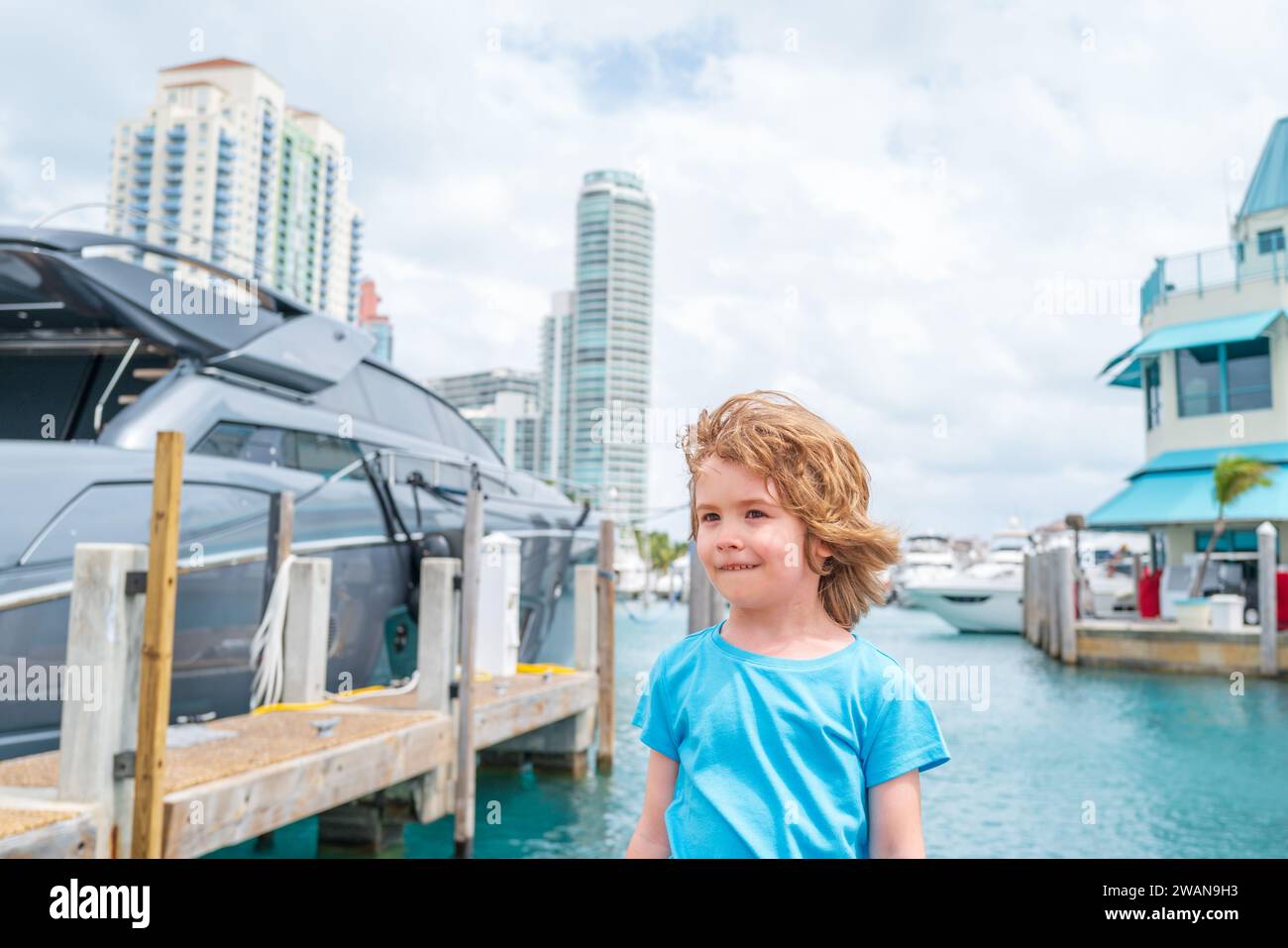 Kid play on Miami marine. Lifestyle portrait of cute kid outdoors ...