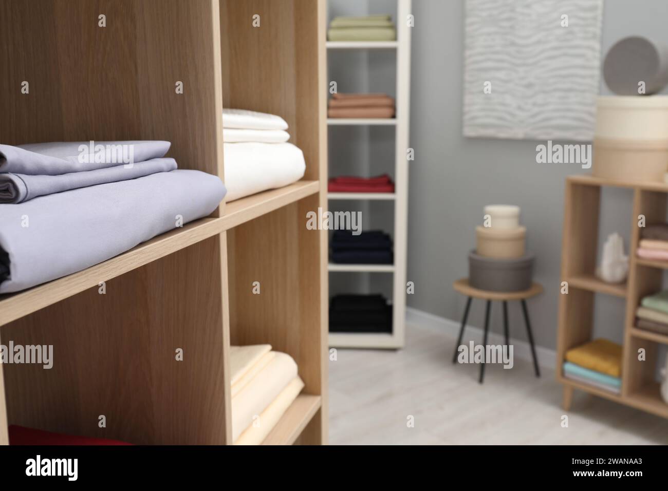 Different colorful bed linens on display in home textiles store Stock ...