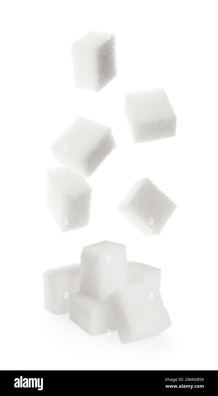 Cubes of sugar falling on white background Stock Photo - Alamy