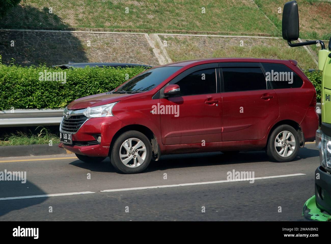 red maroon Toyota Avanza car, in highway Outer ring Road, Jakarta ...