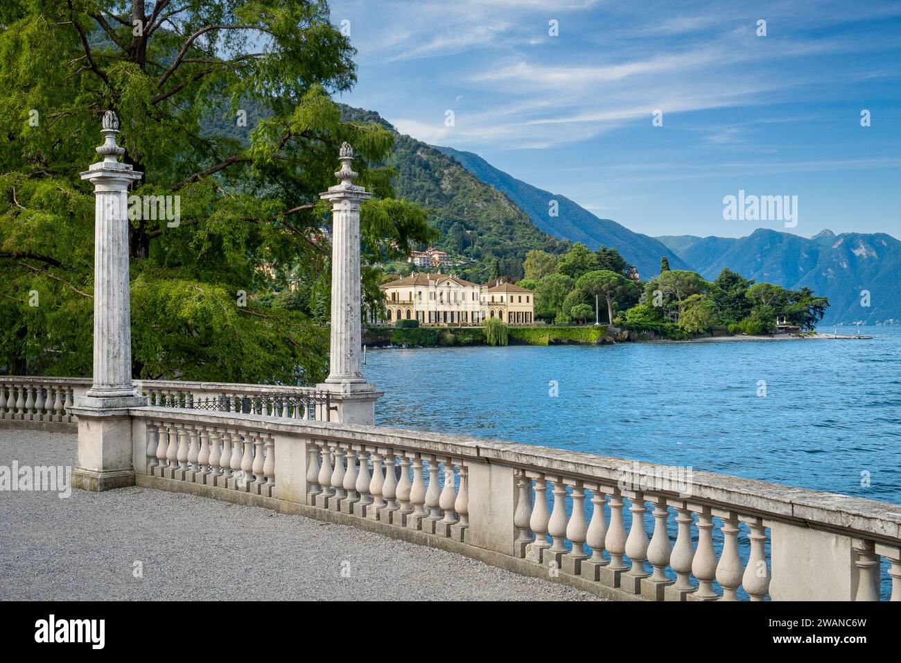 Villa Melzi viewed from the curved promenade at the gardens in Bellagio ...