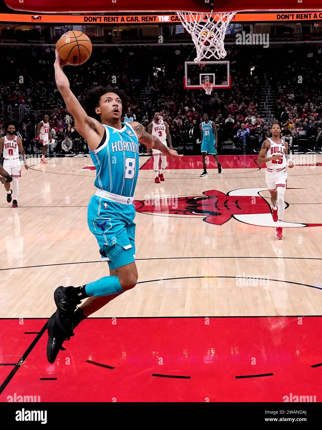 Charlotte Hornets' Nick Smith Jr. goes up for a breakaway dunk during ...