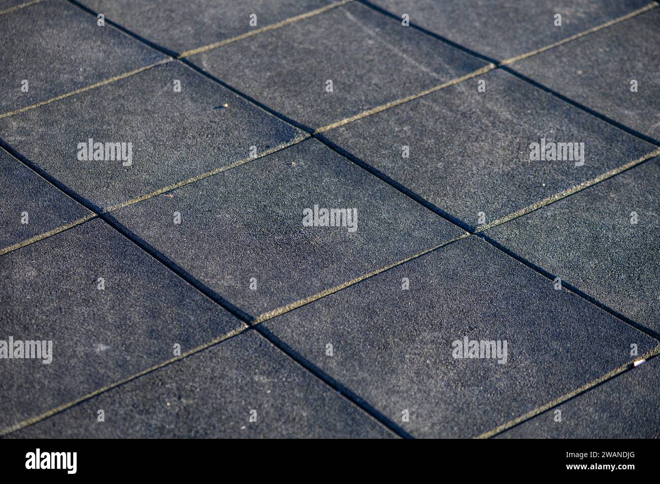 rubber soft covering with squares on the playground 8 Stock Photo - Alamy