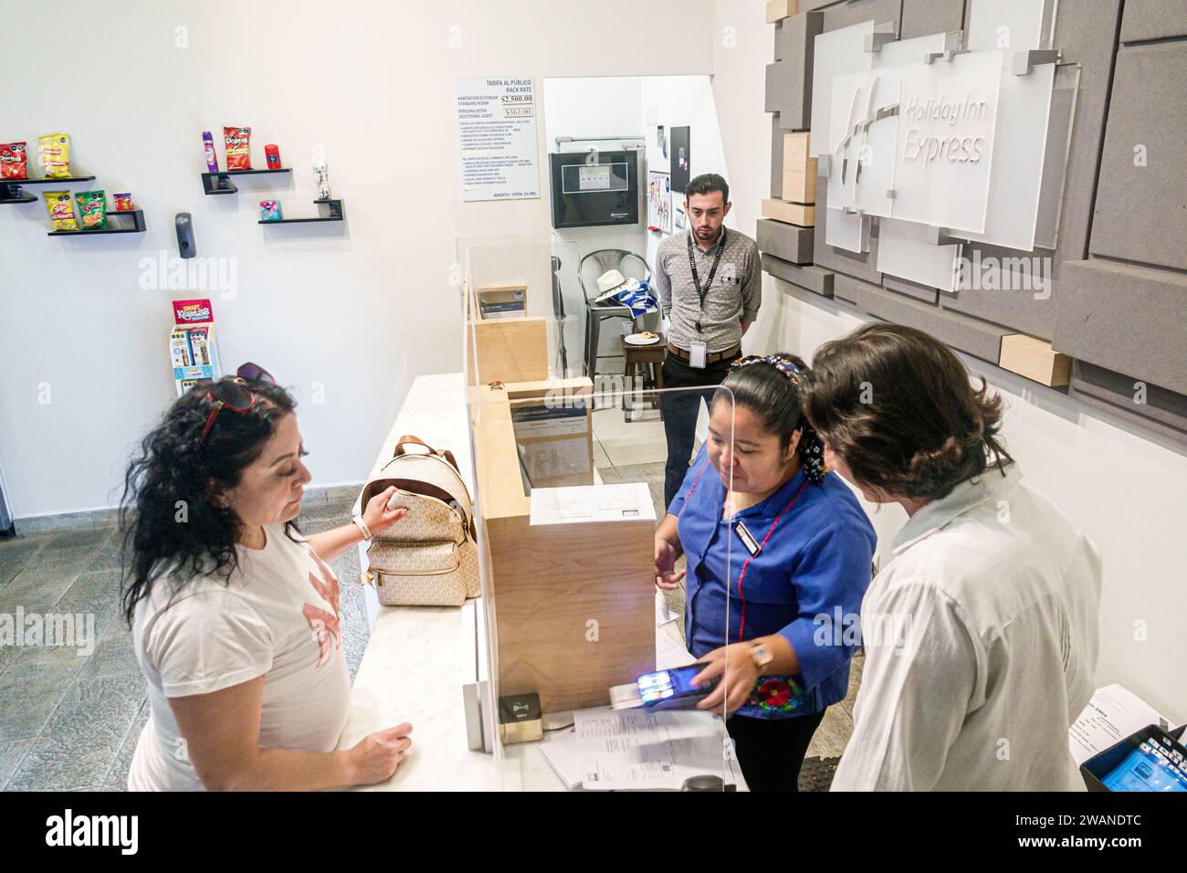 Woman guest counter hi-res stock photography and images - Alamy