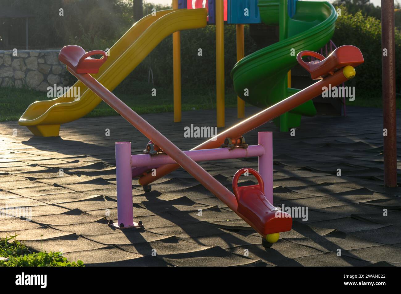 children's swings colorful on the playground in the village Stock Photo ...