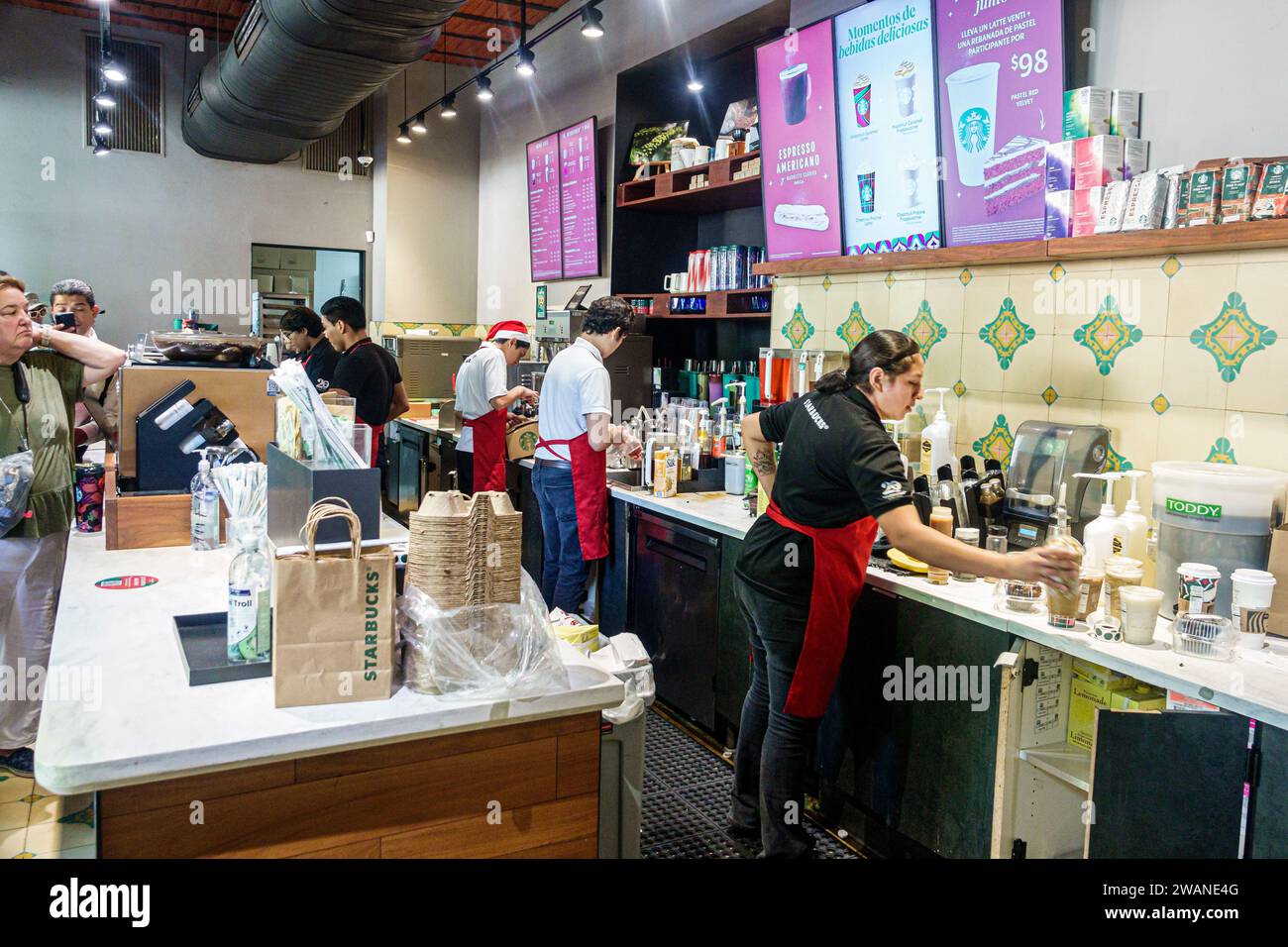 Merida Mexico,centro historico central historic district,Starbucks Coffee cafe baristas,man men ...
