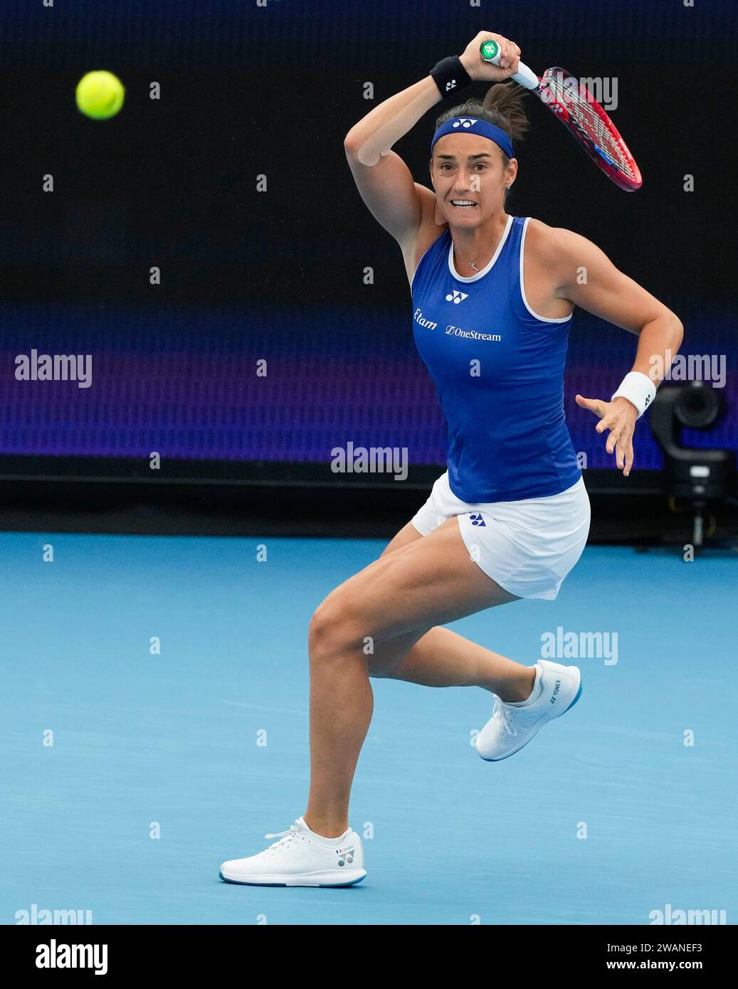 Caroline Garcia of France plays a forehand return to Poland's Iga ...