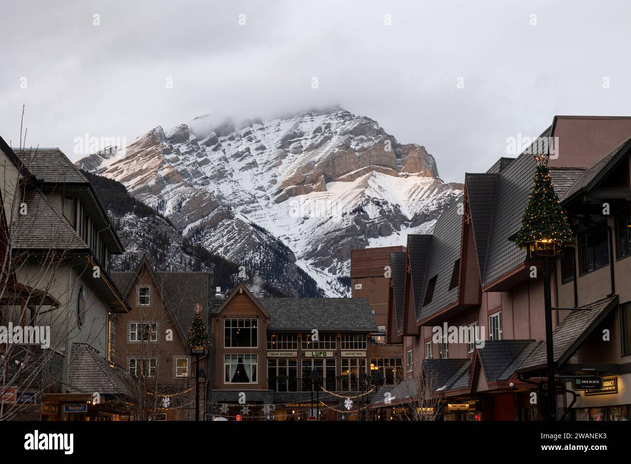 Banff, Alberta, Canada. Looking north at shops and the faint glow of ...