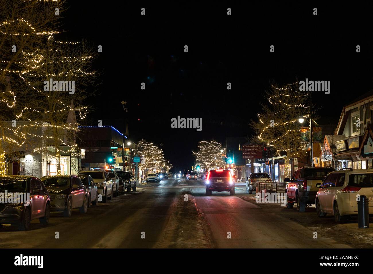 Canmore, Alberta, Canada. Looking west at the shops and lights along ...