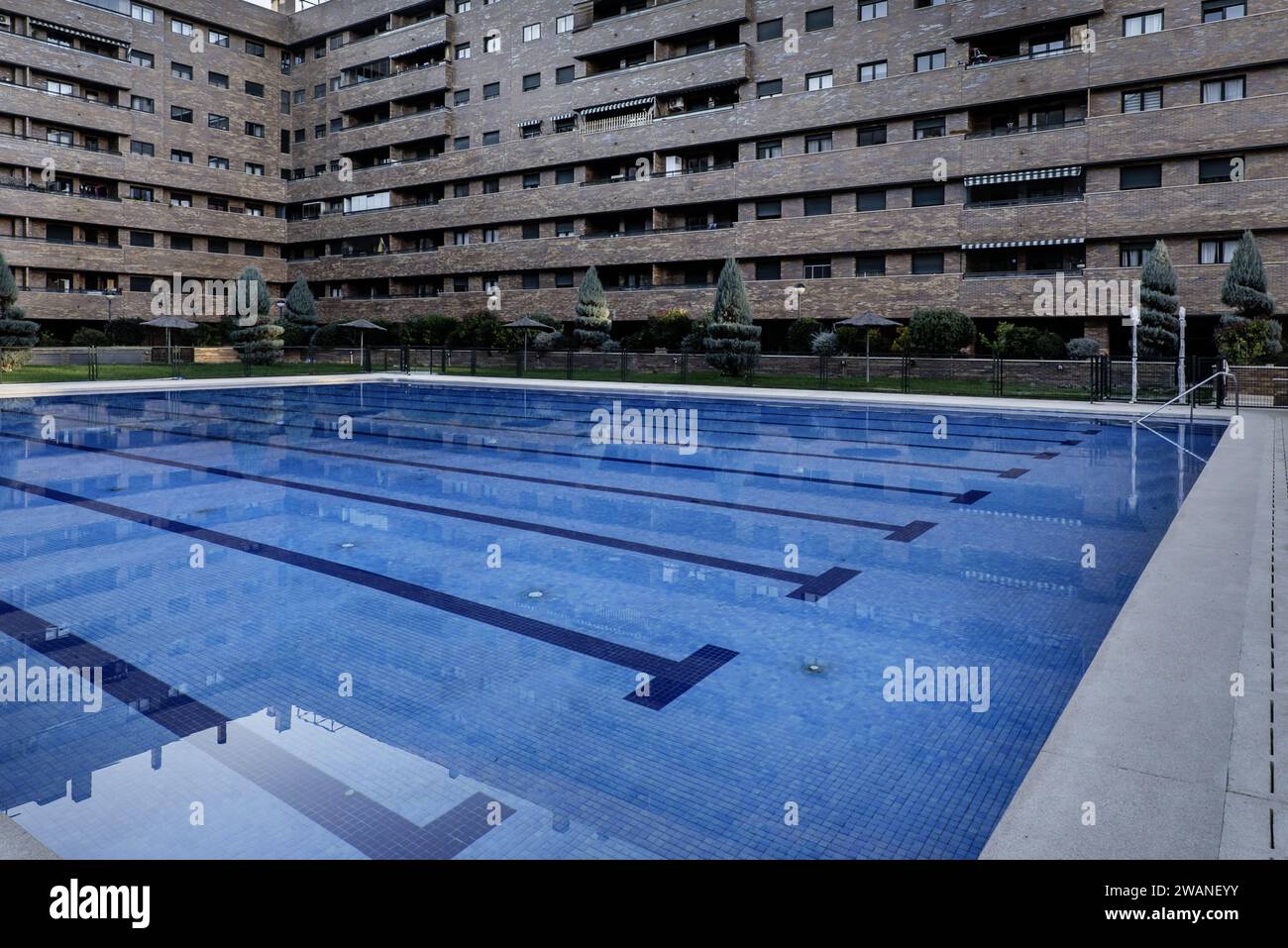 A large swimming pool with defined lanes in the center of the common ...