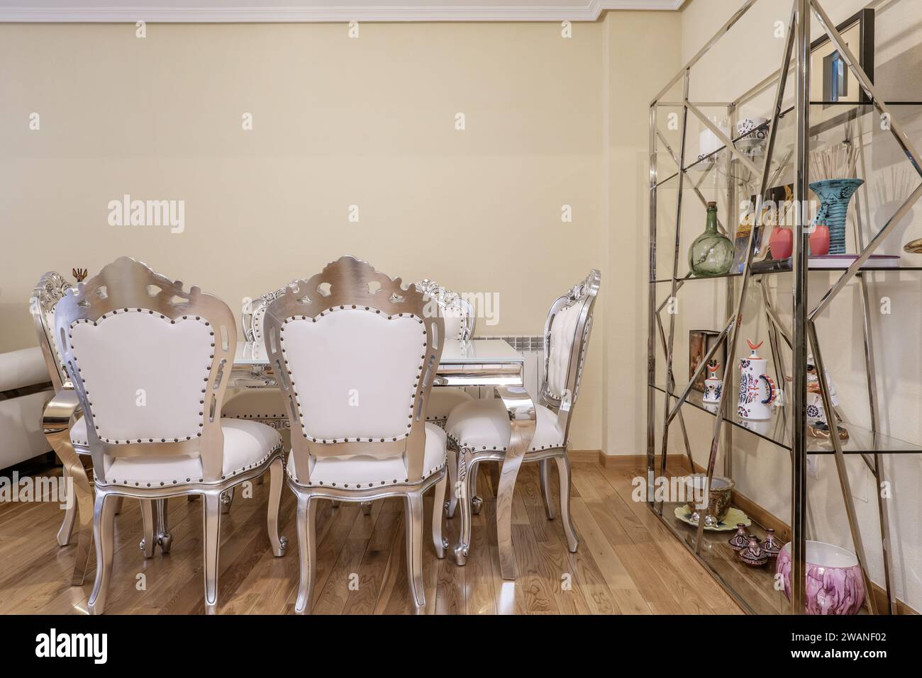 A dining table of questionable beauty with matching chairs in a living ...