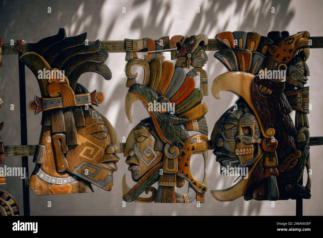 Market stalls selling wooden masks and other local souvenirs and ...