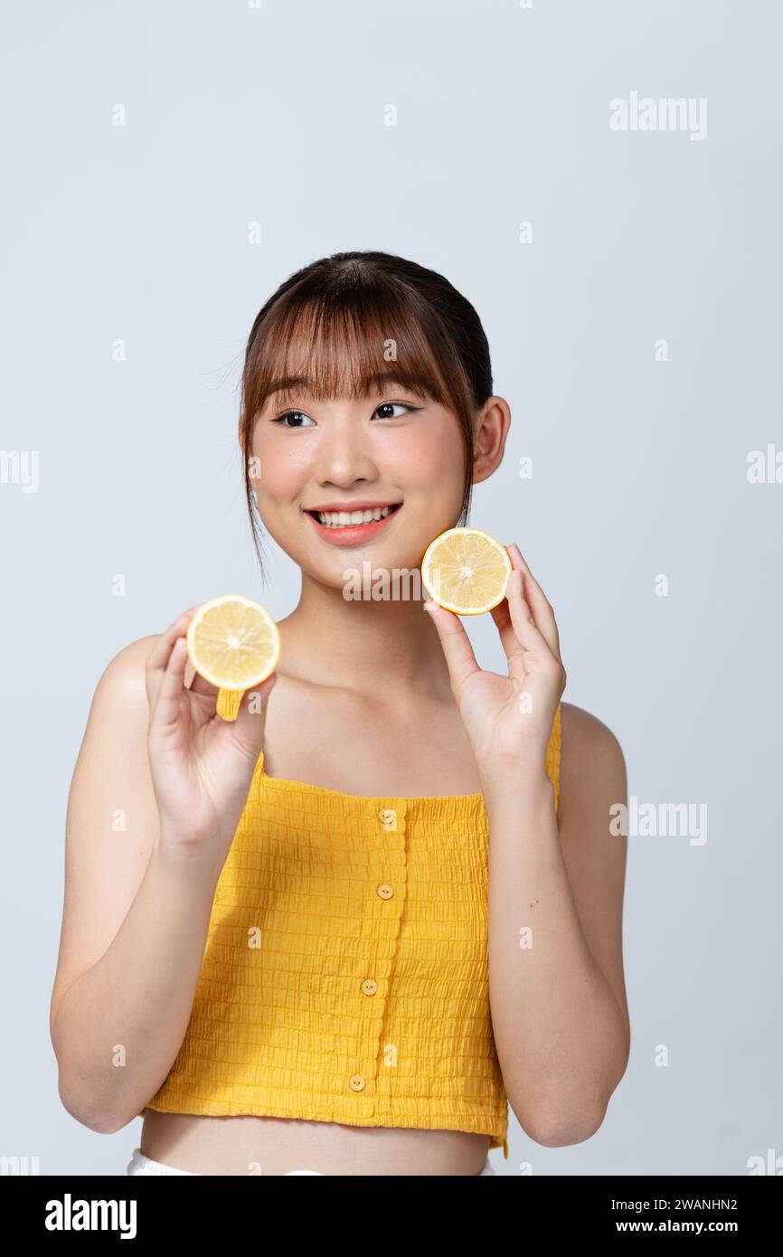 Health girl show lemon with smile face, health food concept, asian woman beauty Stock Photo - Alamy