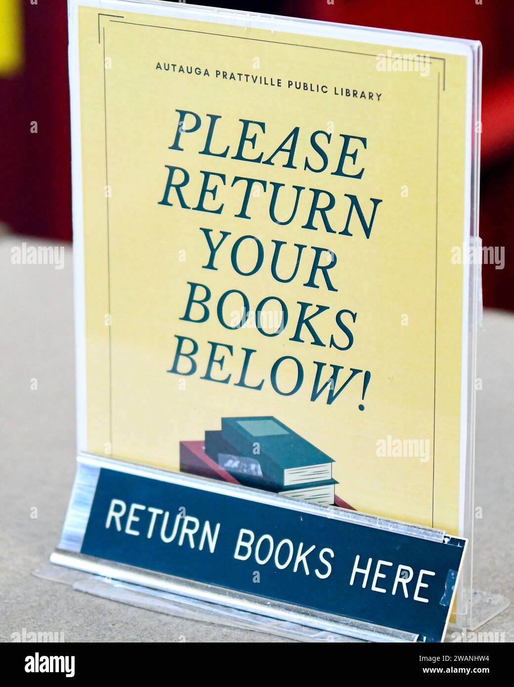 Prattville, Alabama, USA-Dec. 11, 2023: Close-up of book return sign at ...