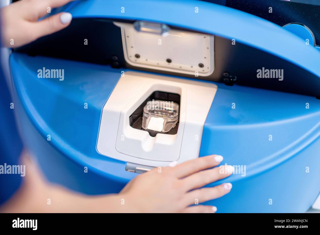 Doctor in the labaratory opens IVF cultivator. Insemination process of ...