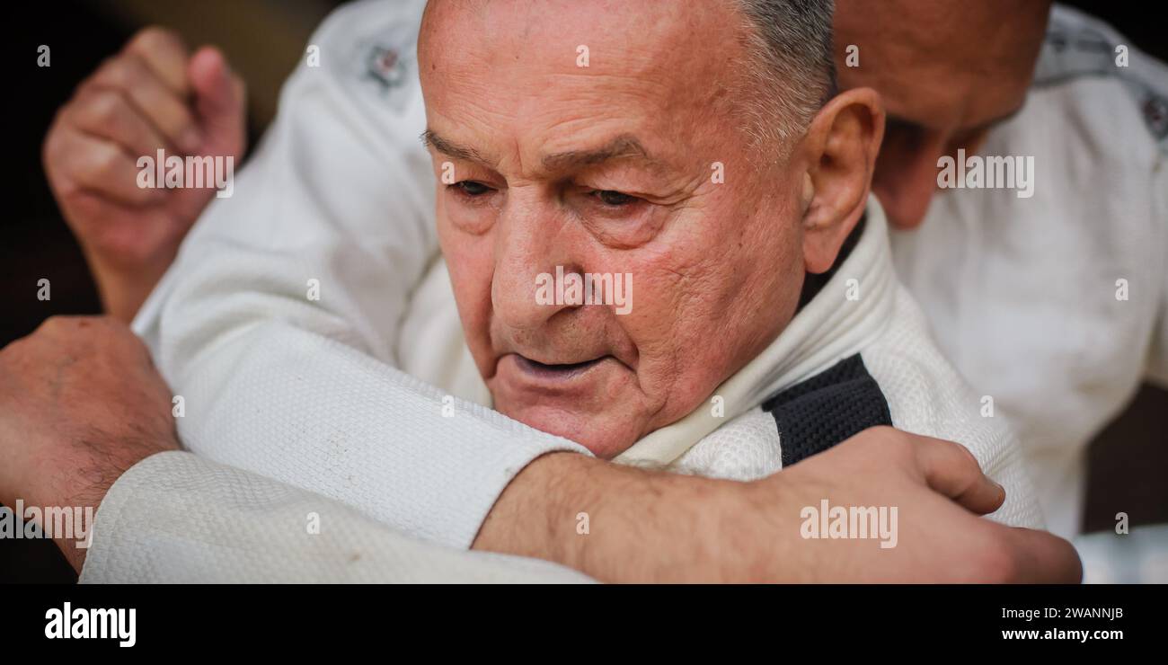 Close-up portrait of judo sensei master instructor in traditional gi ...